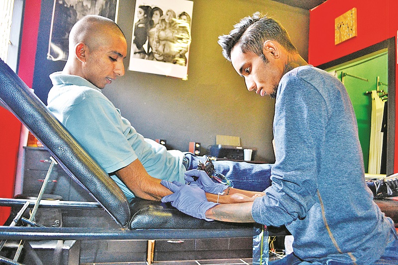 Tattoo artist goes against all odds | Rising Sun Newspapers
