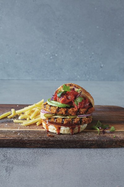 Delicious schnitzel burger with slow-roasted tomatoes | Rising Sun ...
