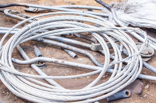 Suspected cable thief found hanging dead on electric railway pole in ...