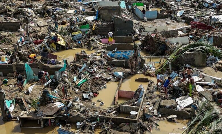 Death toll tops 100 as Philippines digs out after typhoon | The Witness