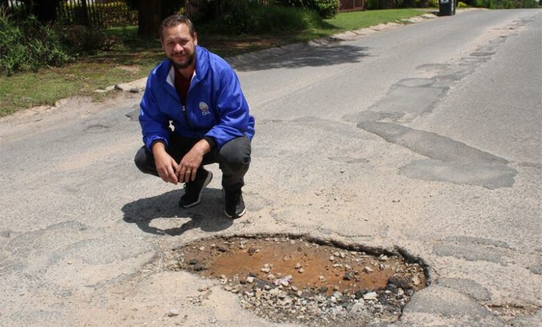 Pothole-infested road remains damaged