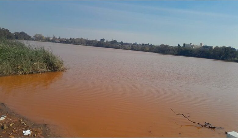 WATCH: Lake water turns rust red after suspected industrial chemical ...