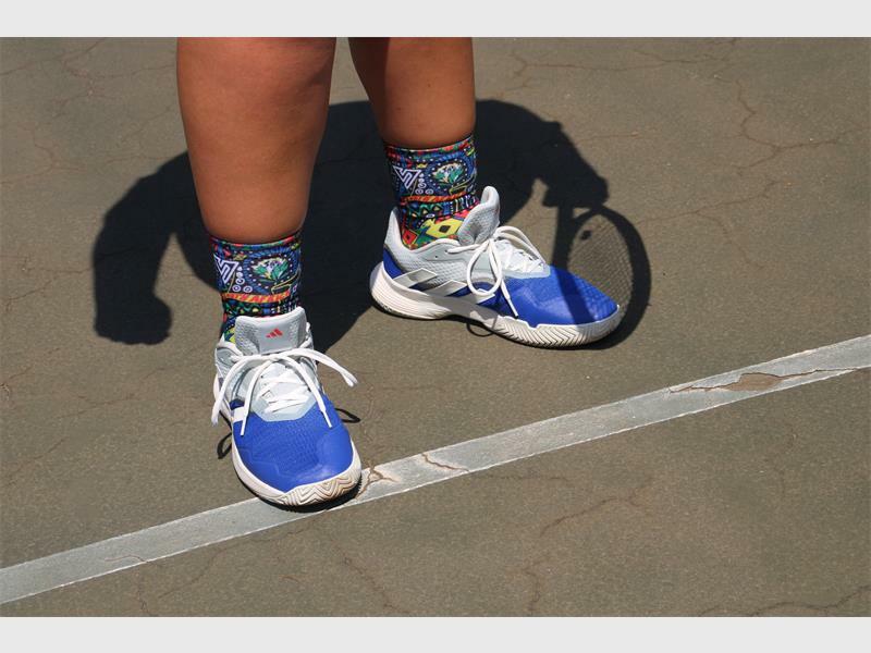 Funky socks at tennis club | Springs Advertiser