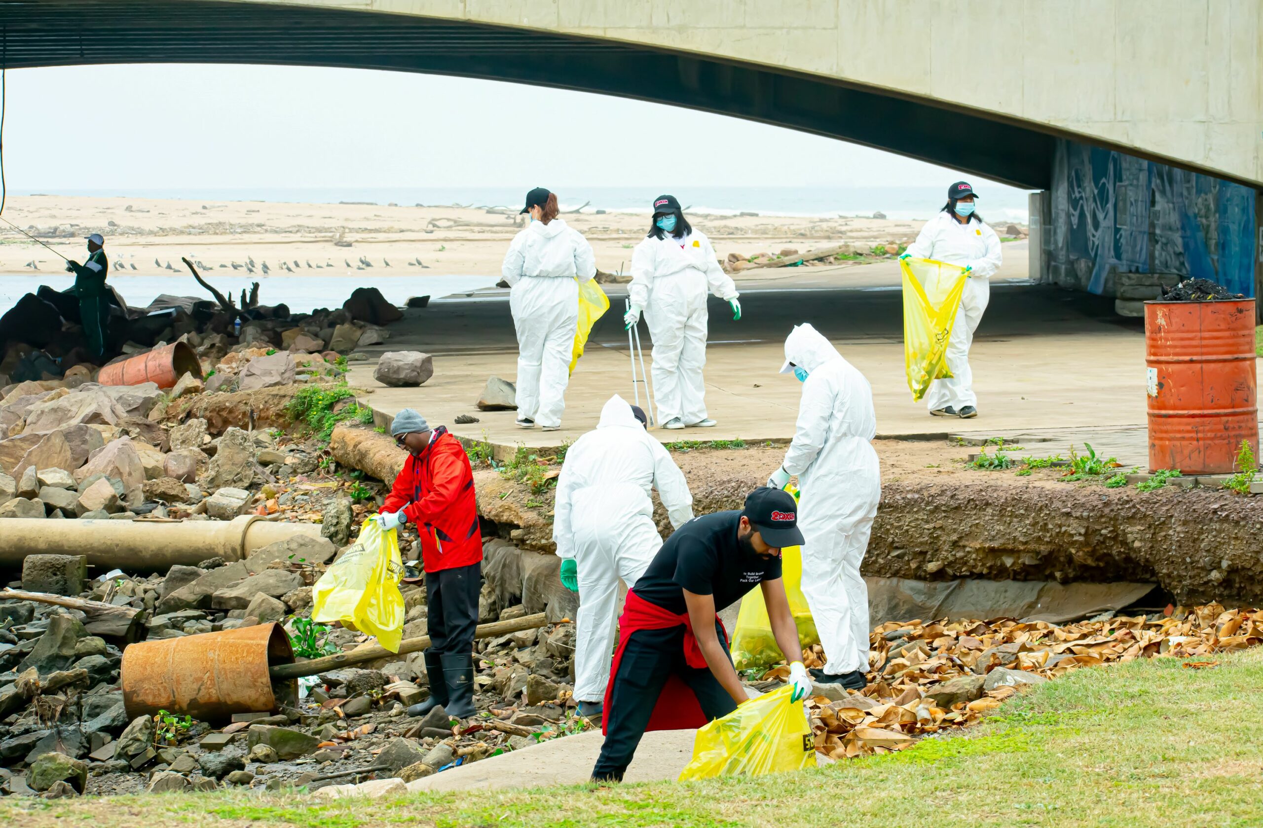 Volunteers keep environment clean by picking up trash at Blue Lagoon ...