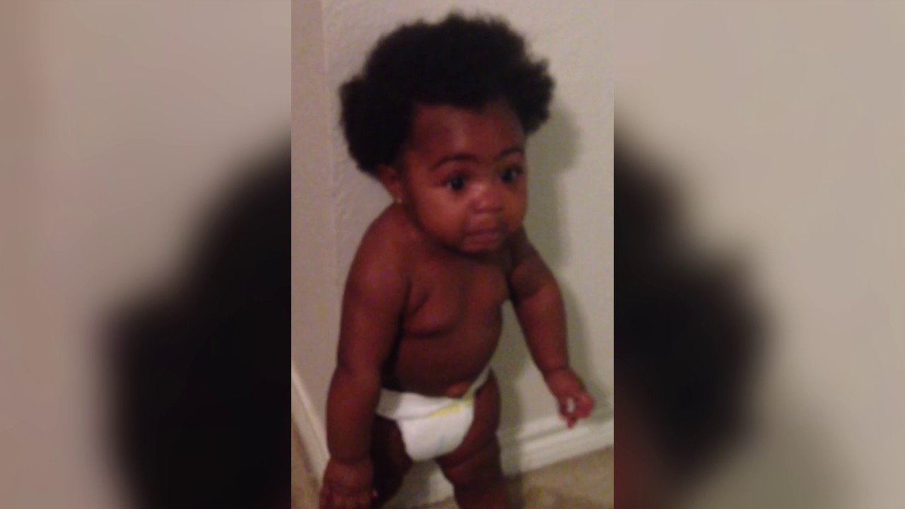 Baby flexes muscles with daddy | South Coast Herald