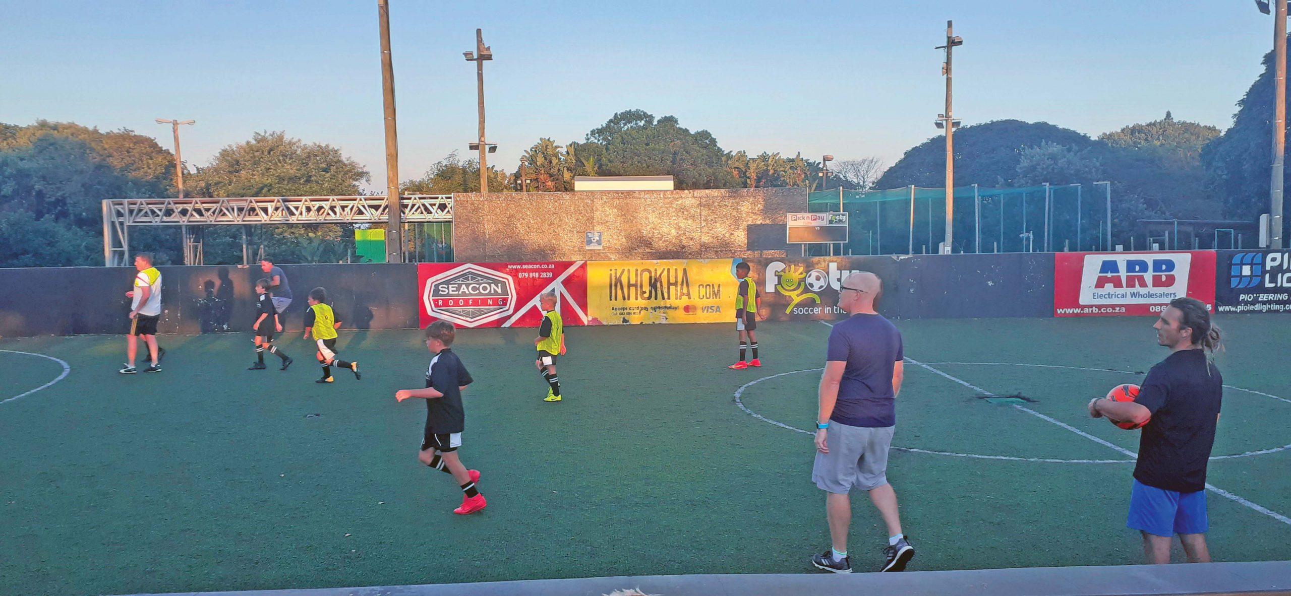 Footy kids show off their skills while dribbling against dads | North ...