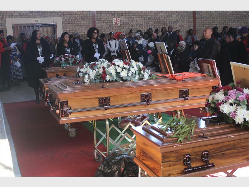 Final respect paid to mother and 3 sons who died in shack fire in ...